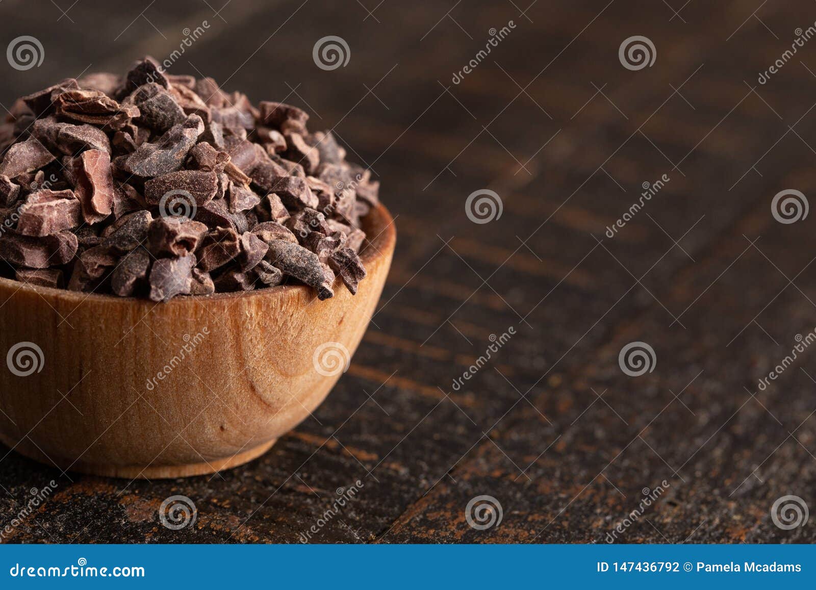 Bowl of Raw Chocolate Nibs on a Rustic Wooden Table Stock Photo - Image ...