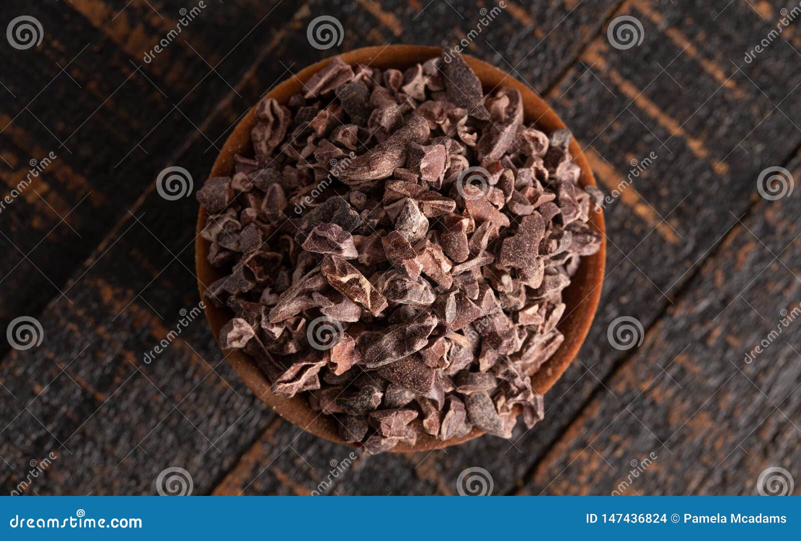 Bowl of Raw Chocolate Nibs on a Rustic Wooden Table Stock Photo - Image ...