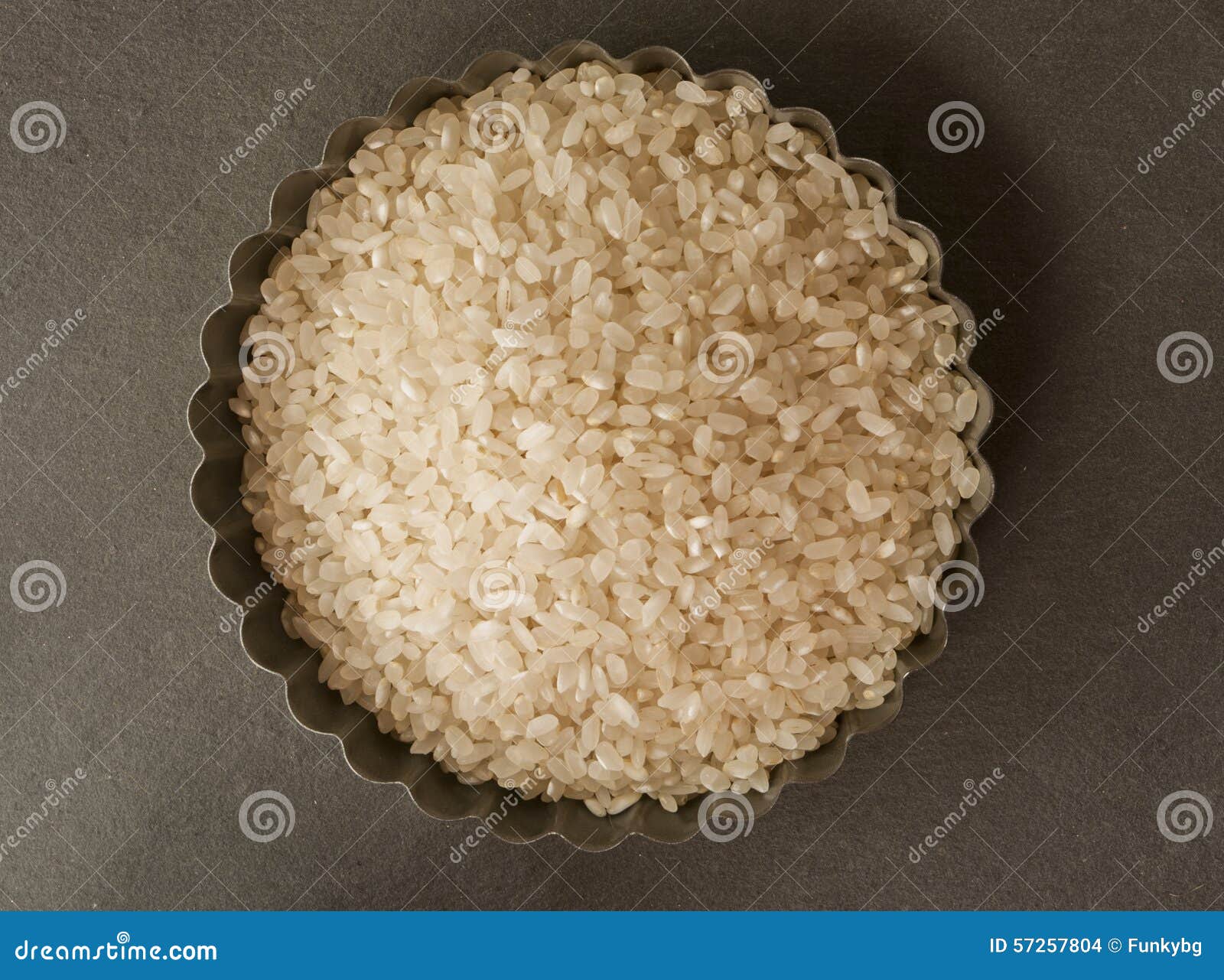 Bowl of raw rice grains stock photo. Image of bamboo - 57257804