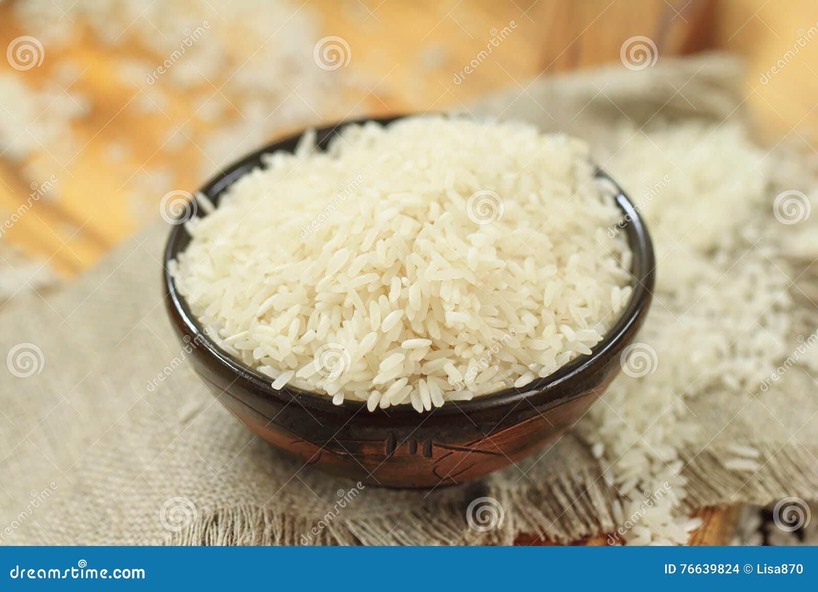 Bowl of raw rice grains stock photo. Image of cereal - 76639824