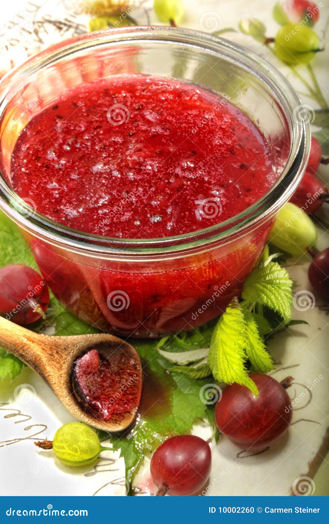 Bowl of red gooseberry jam stock photo. Image of glass - 10002260