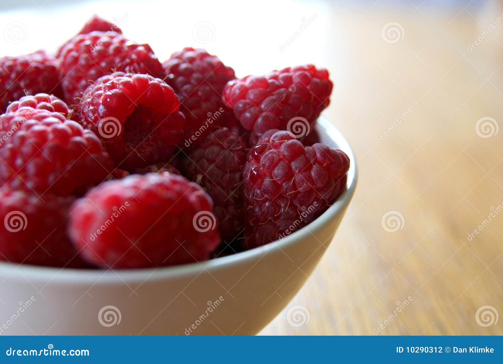 Bowl of Red Raspberries stock photo. Image of berry, green - 10290312