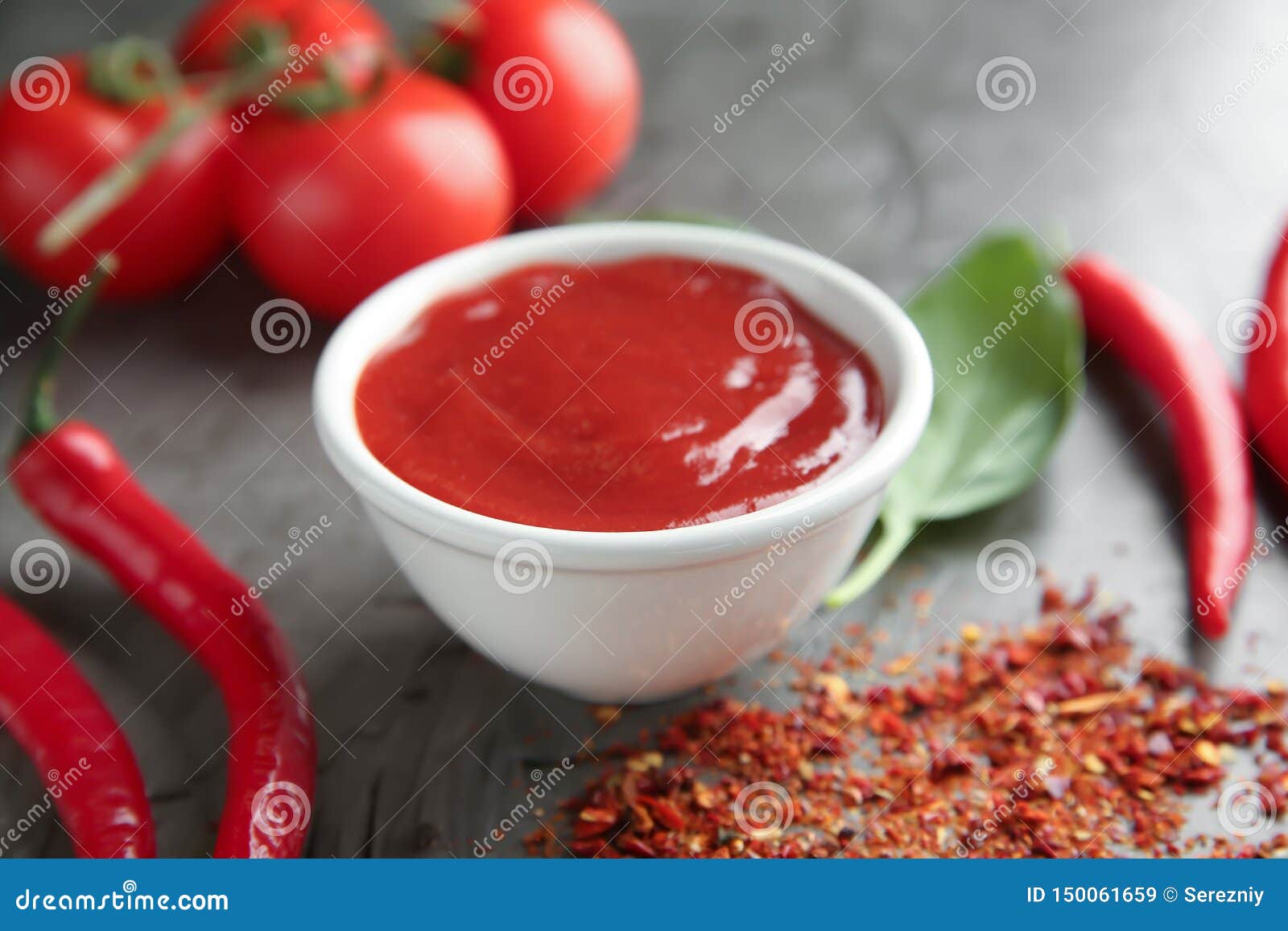 Bowl with Red Sauce and Vegetables on Grey Background Stock Image ...