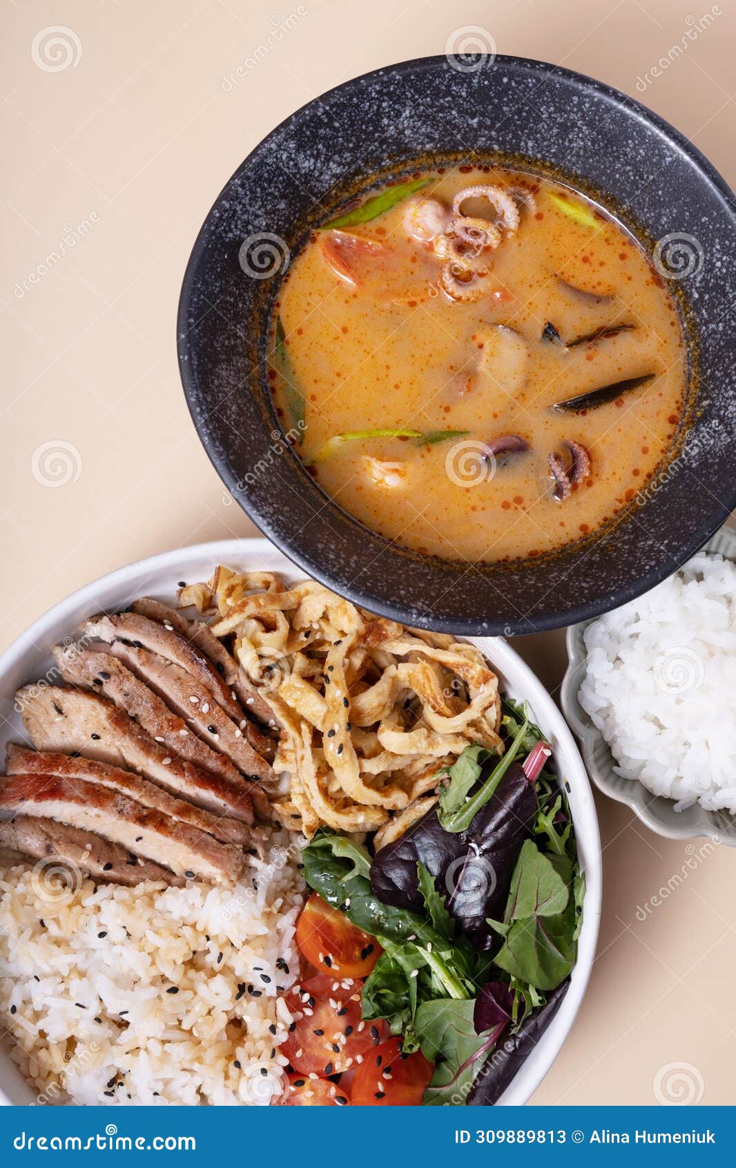 Bowl with Rice, Veal and Vegetables and Tom Yam Soup Angle View. Stock ...
