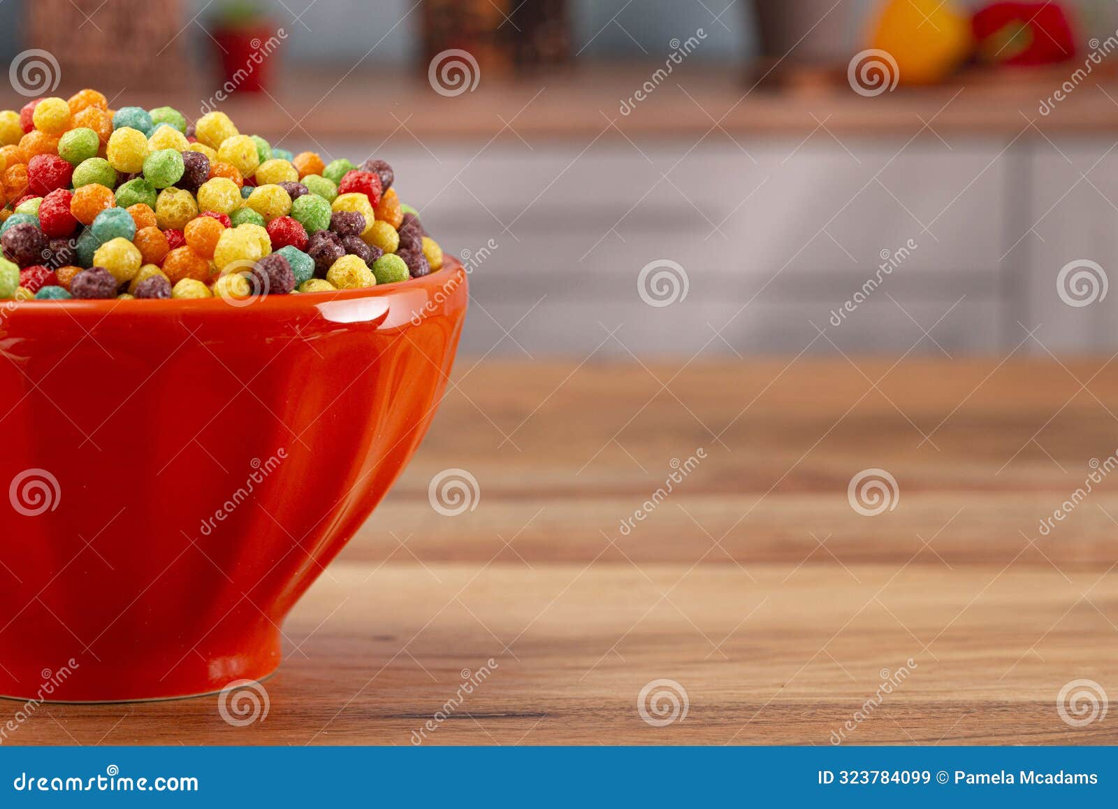 A Bowl of Small Ball Shaped Fruit Flavored Breakfast Cereal on a Wooden ...