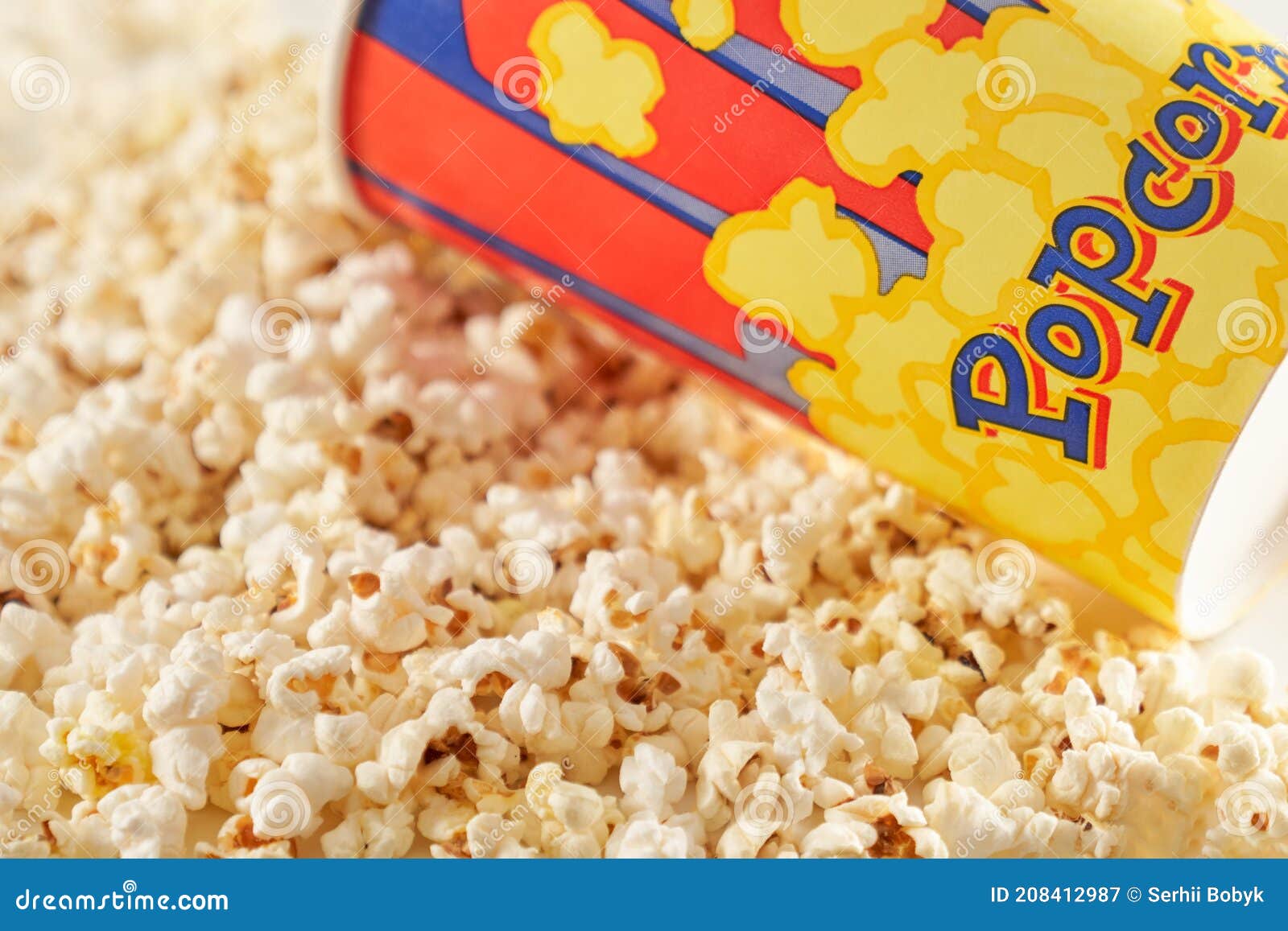 Bowl with spilled popcorn. stock image. Image of background - 208412987