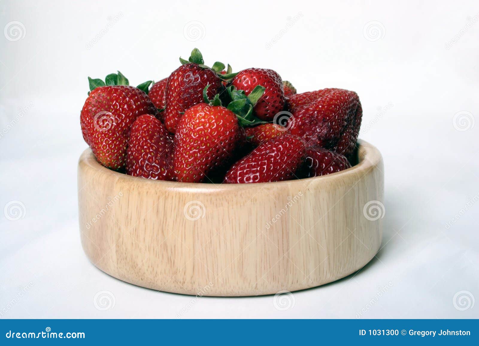 A bowl of strawberries. stock photo. Image of fruit, green - 1031300