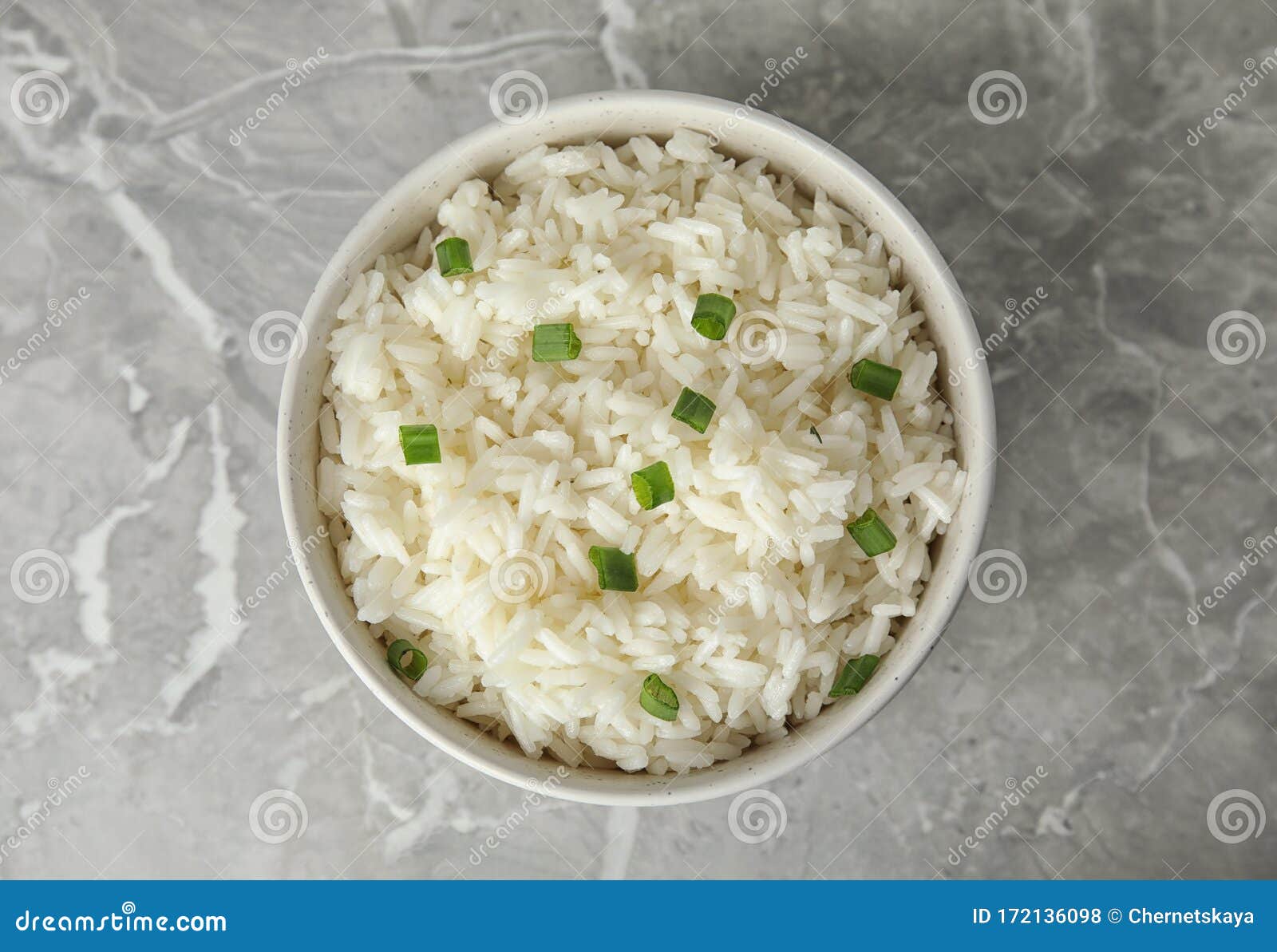 Bowl with Tasty Cooked Rice on Light Grey Marble Table Stock Photo ...