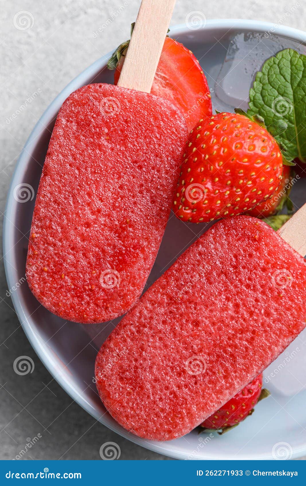 Bowl of Tasty Strawberry Ice Pops on Grey Table, Top View. Fruit ...