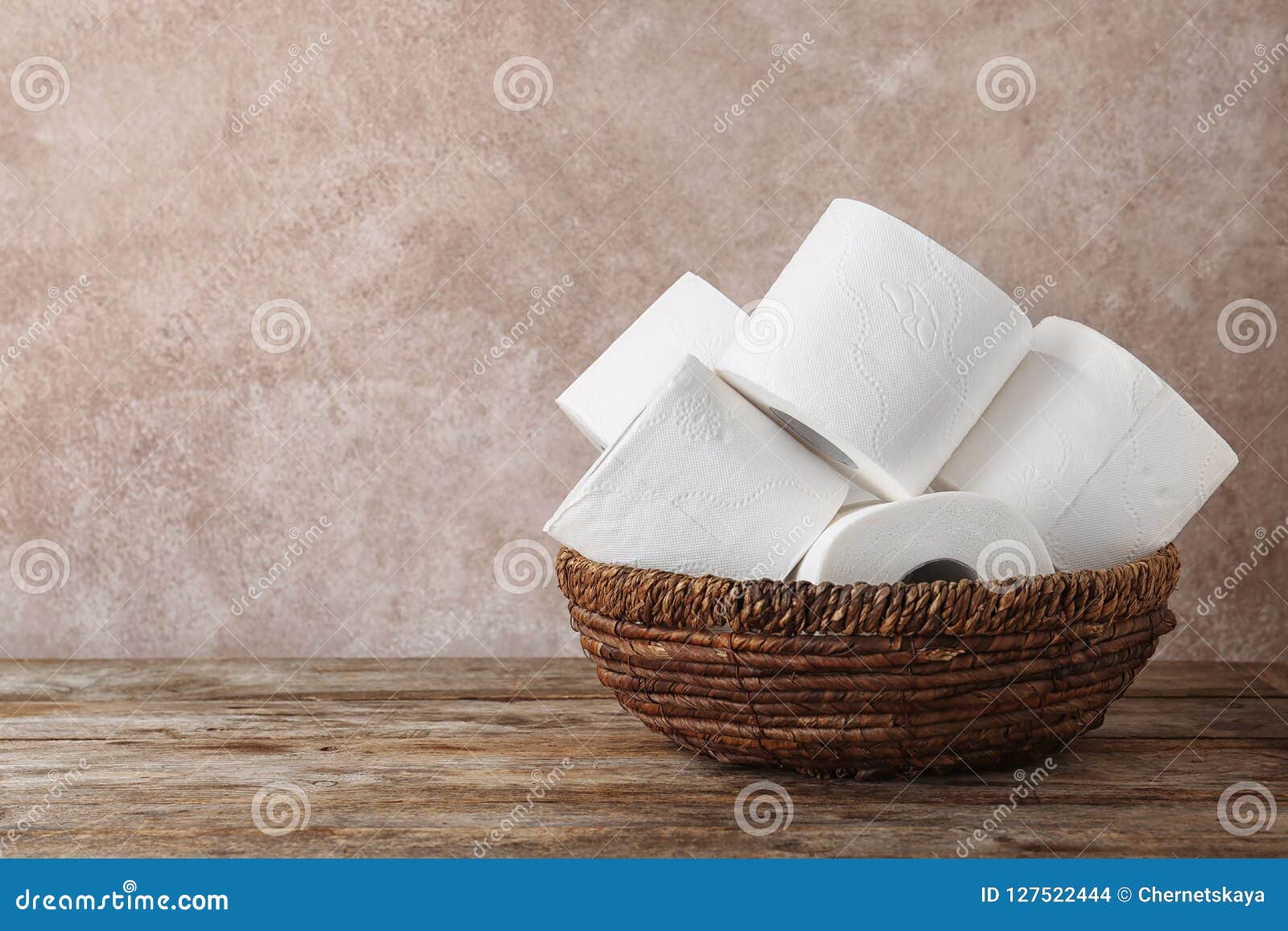 Bowl with Toilet Paper Rolls on Wooden Table Stock Photo - Image of ...