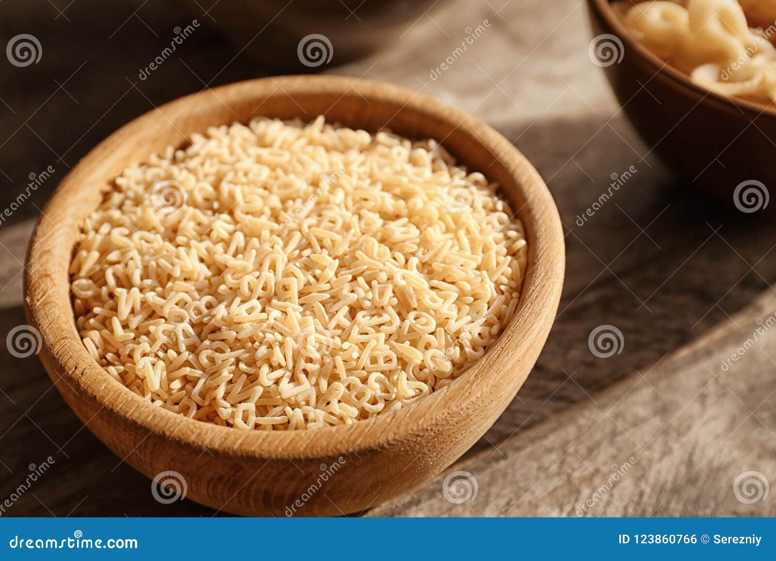 Bowl with Uncooked Pasta on Table Stock Photo - Image of recipe ...