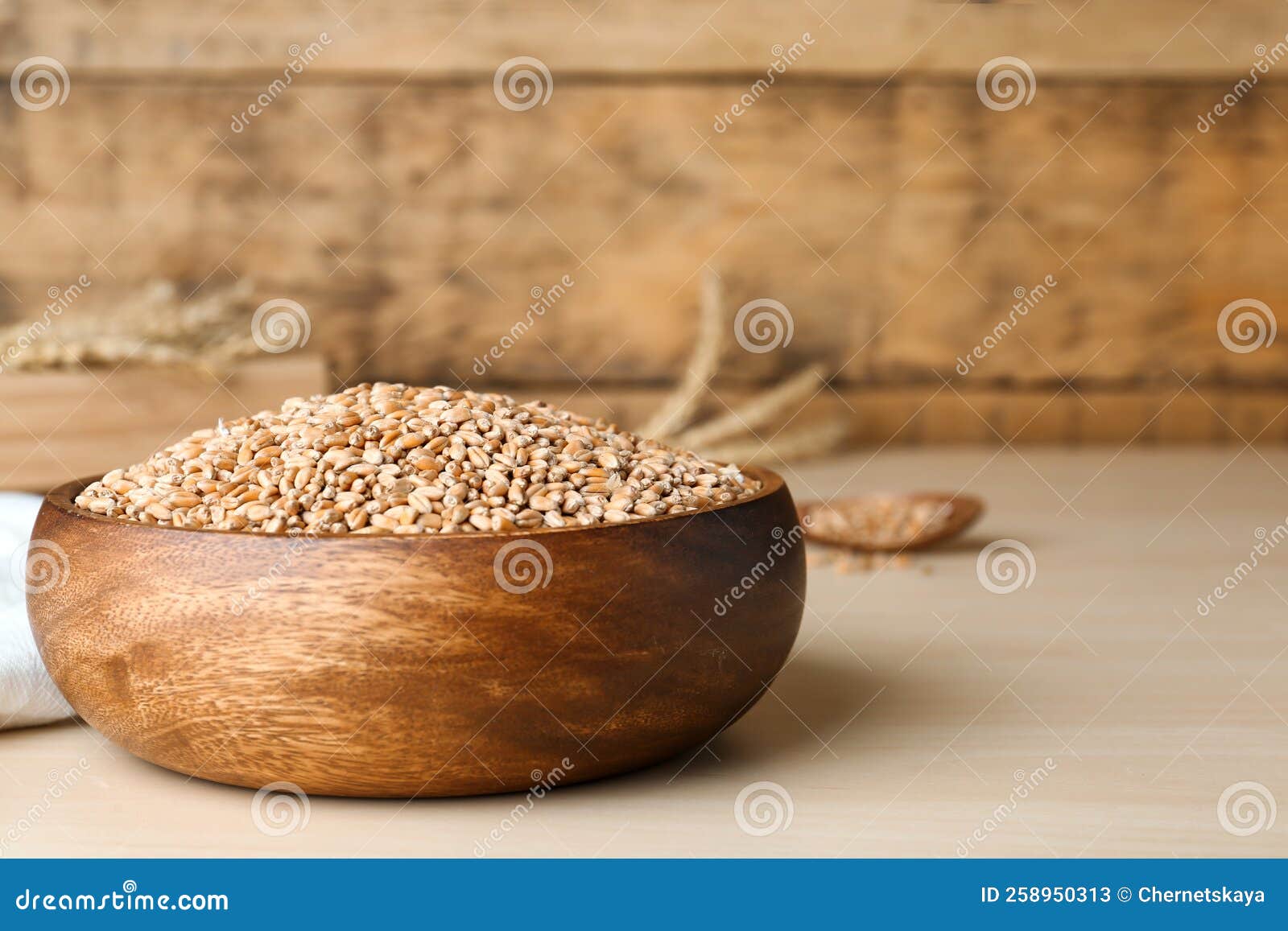 Bowl of Wheat Grains on White Wooden Table, Closeup. Space for Text ...