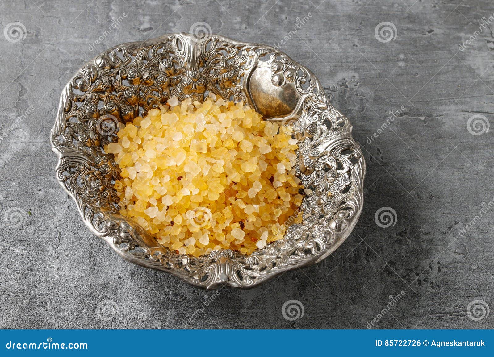Bowl of yellow sea salt stock photo. Image of aromatherapy - 85722726