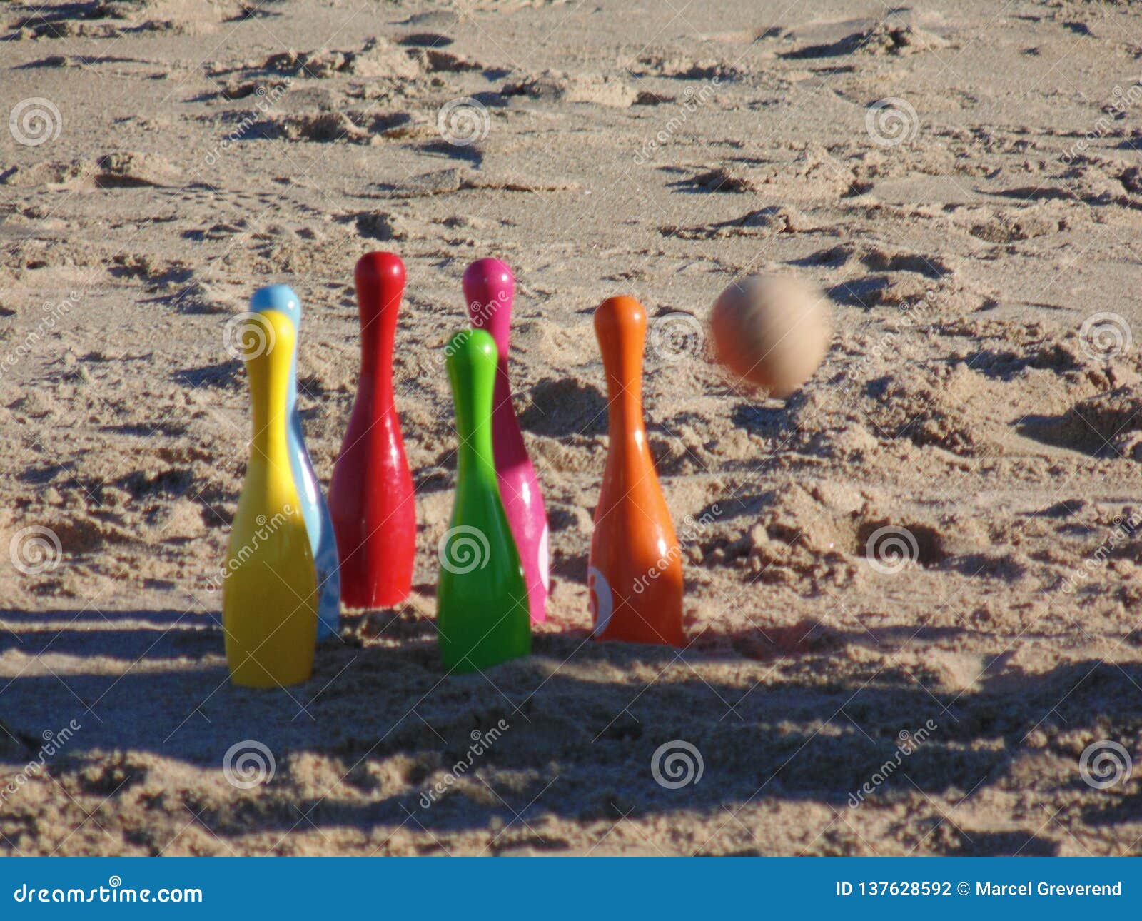 Bowling on the Beach before Impact Stock Photo - Image of summer, blue ...