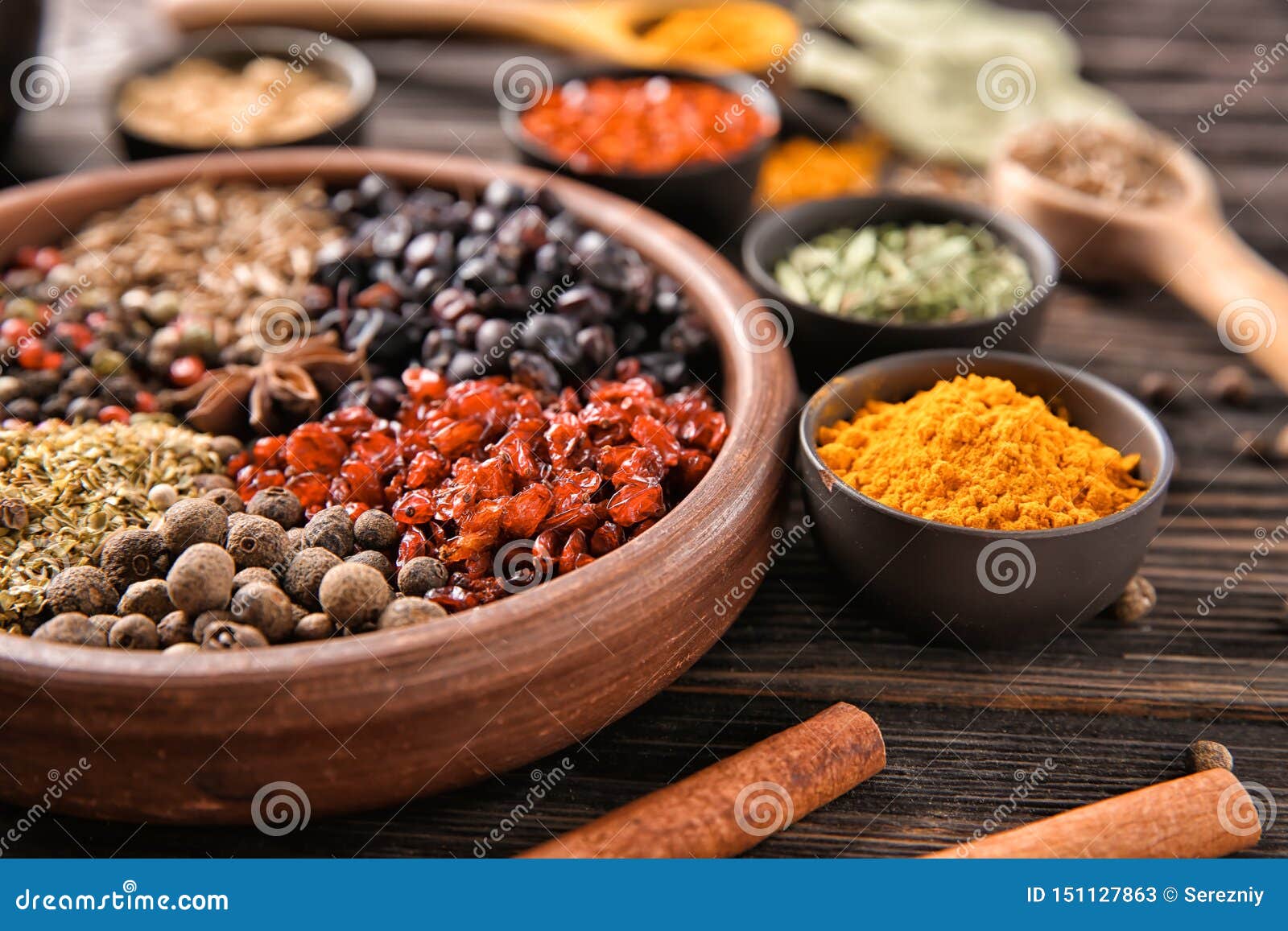 Bowls with Different Dry Spices on Wooden Background Stock Image ...