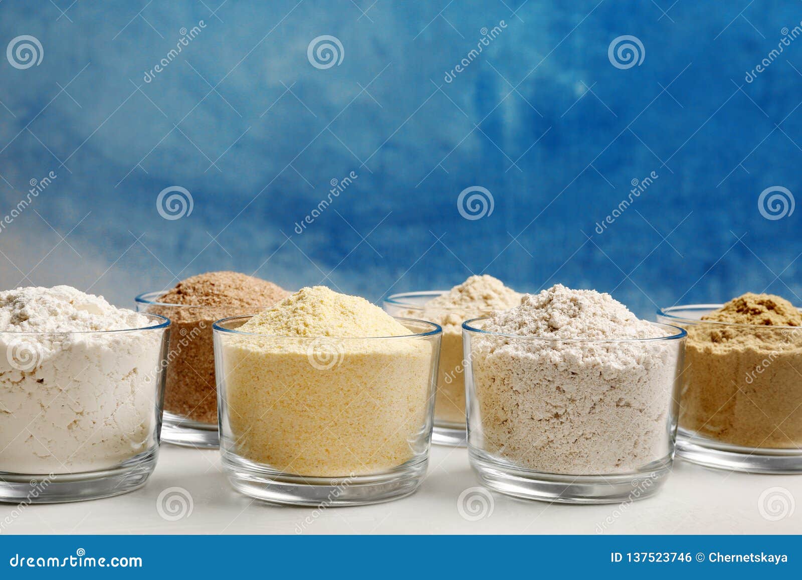 Bowls with Different Types of Flour on Table Stock Photo - Image of ...