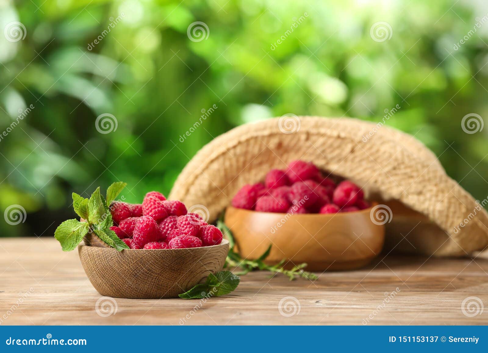 Bowls with Fresh Ripe Raspberries on Table Outdoors Stock Image - Image ...