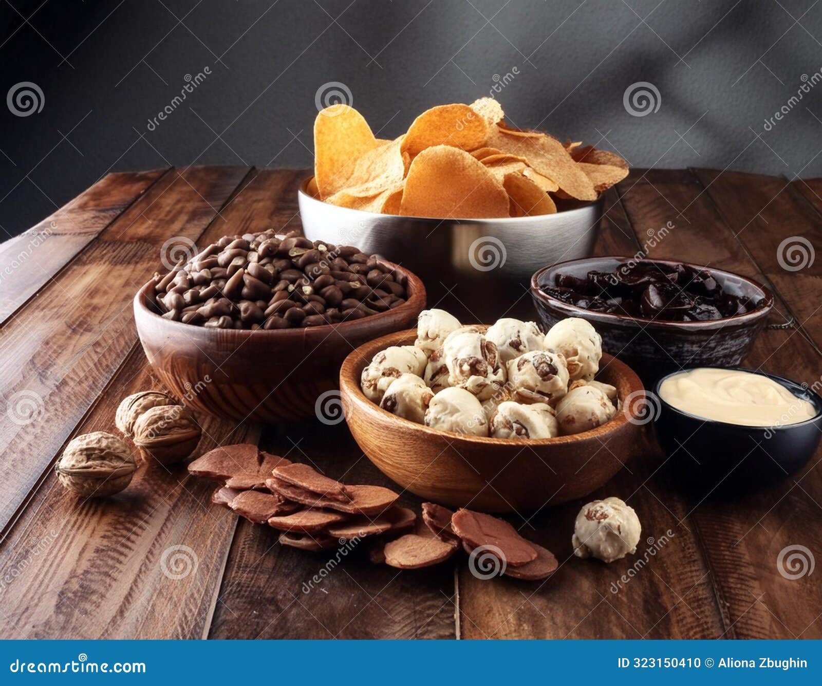 Bowls of Popcorn, Chips, Nuts, and a Dip on a Coffee Table Stock ...