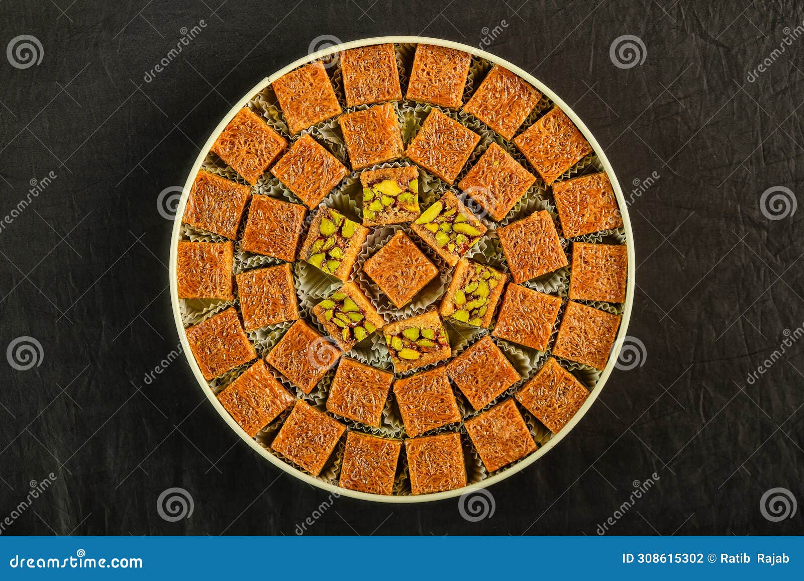 A Box of Assorted Arabic Sweets with Pistachios Stock Photo - Image of ...