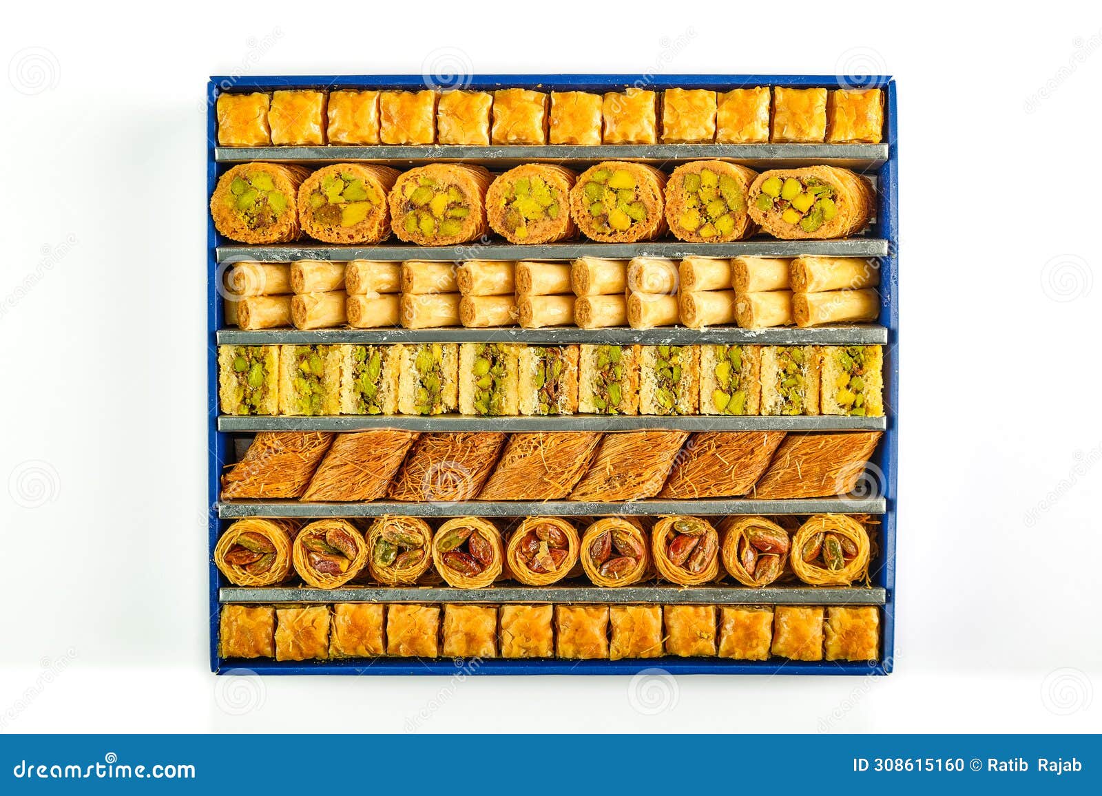 A Box of Assorted Arabic Sweets with Pistachios Stock Photo - Image of ...