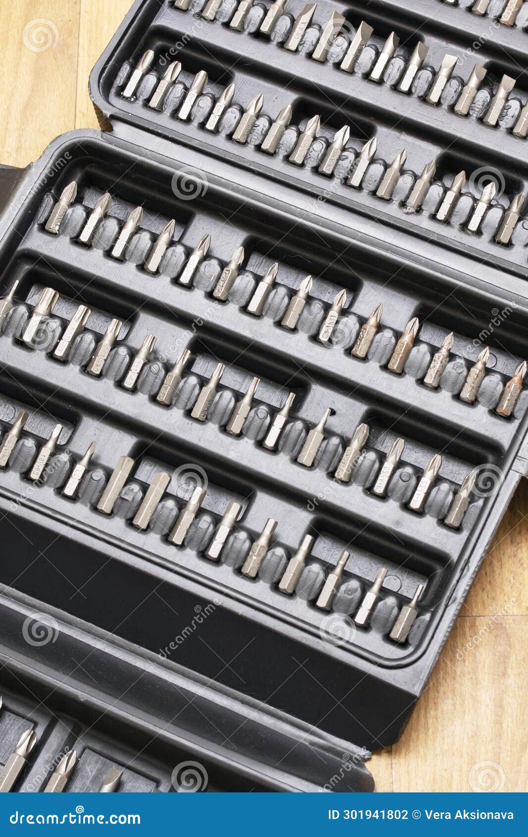 Box with Bits for Screwdriver on Wooden Floor Stock Photo - Image of ...