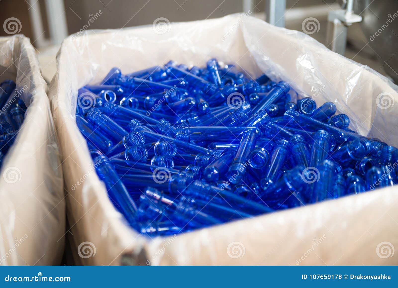 A Box of Blue Plastic Preforms Stock Photo - Image of line, processing ...