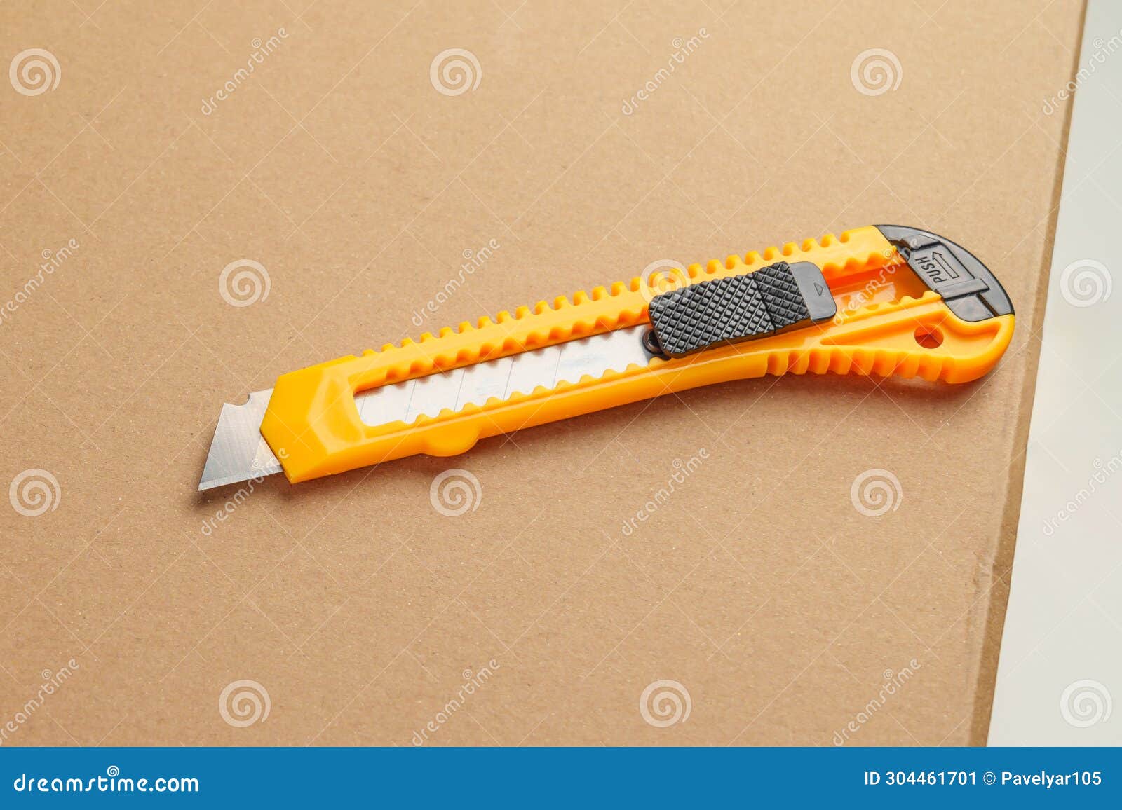 Box Cutter on a Parcel Cardboard Box. Retractable Utility Knife Stock ...