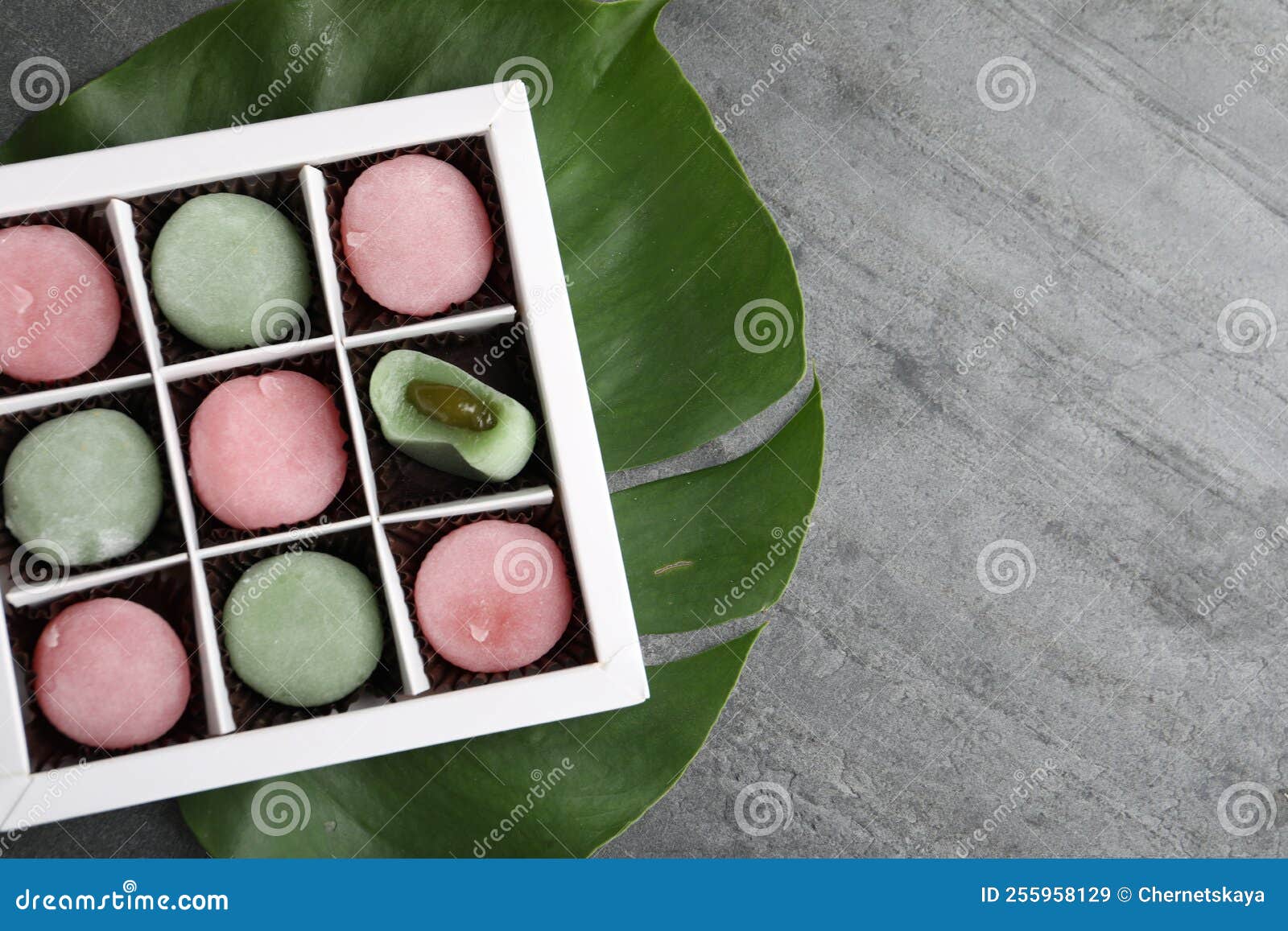 Box with Different Delicious Mochi on Grey Table, Top View. Space for ...