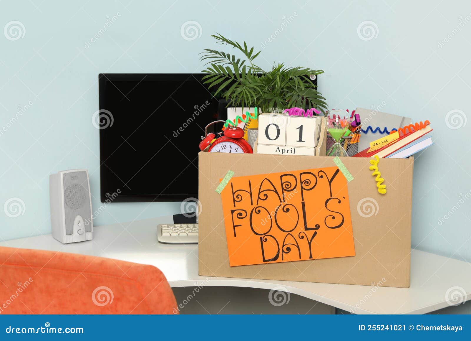 Box with Different Items and Words Happy Fool`s Day at Workplace in ...