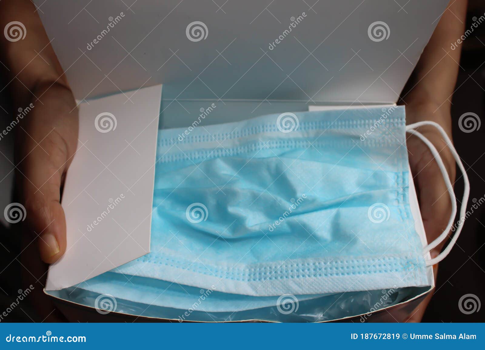 A Box Full of Blue Surgical Masks in Hand Stock Image - Image of ...