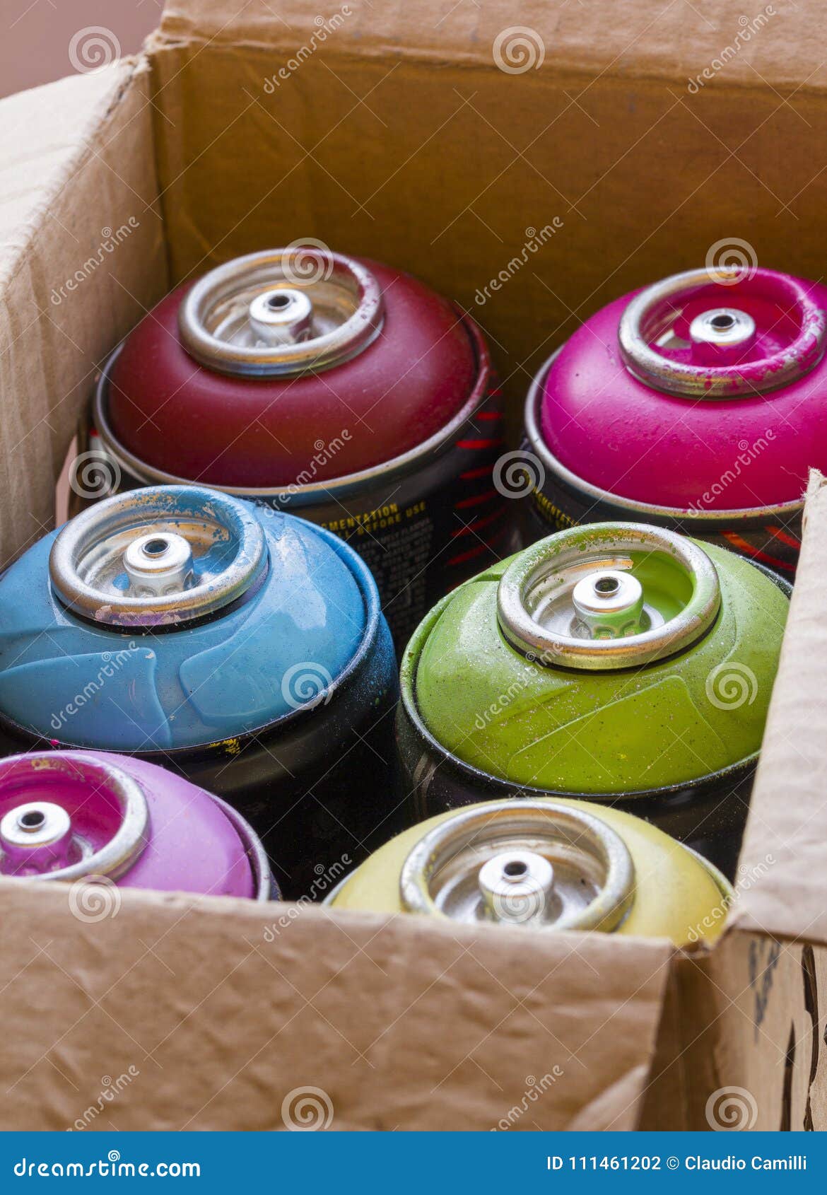 Spray cans on paper box stock photo. Image of closeup - 111461202
