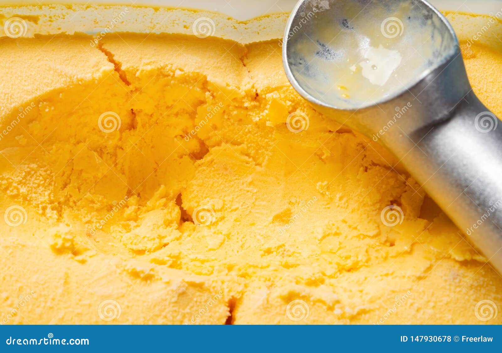 Mango Flavor Ice Cream with a Spoon and Some Digged Out Stock Photo ...