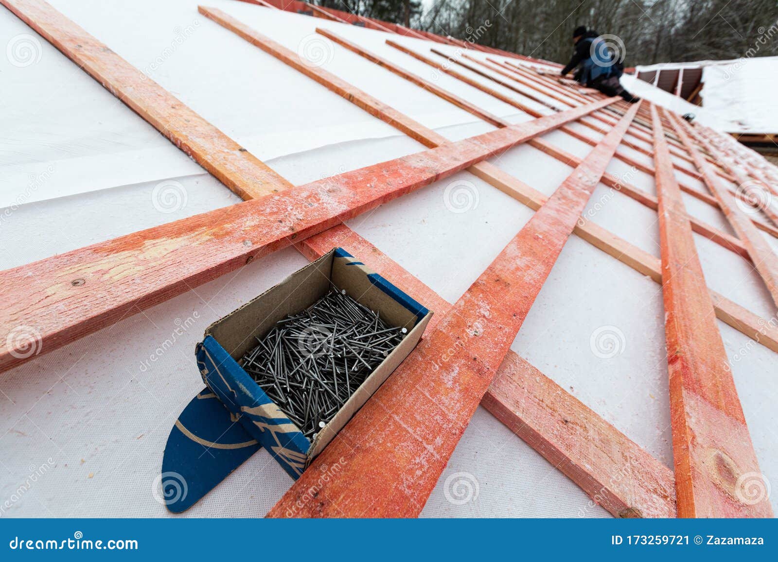 The Box with Nails on the Roof and Roofer Working on Roof Structure of ...