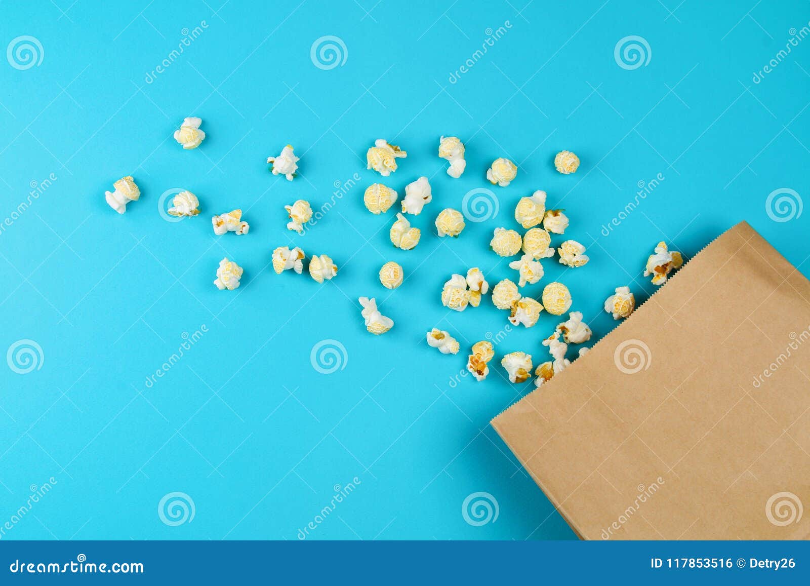 Box of Popcorn Spilled on Blue Background. Stock Photo - Image of paper ...
