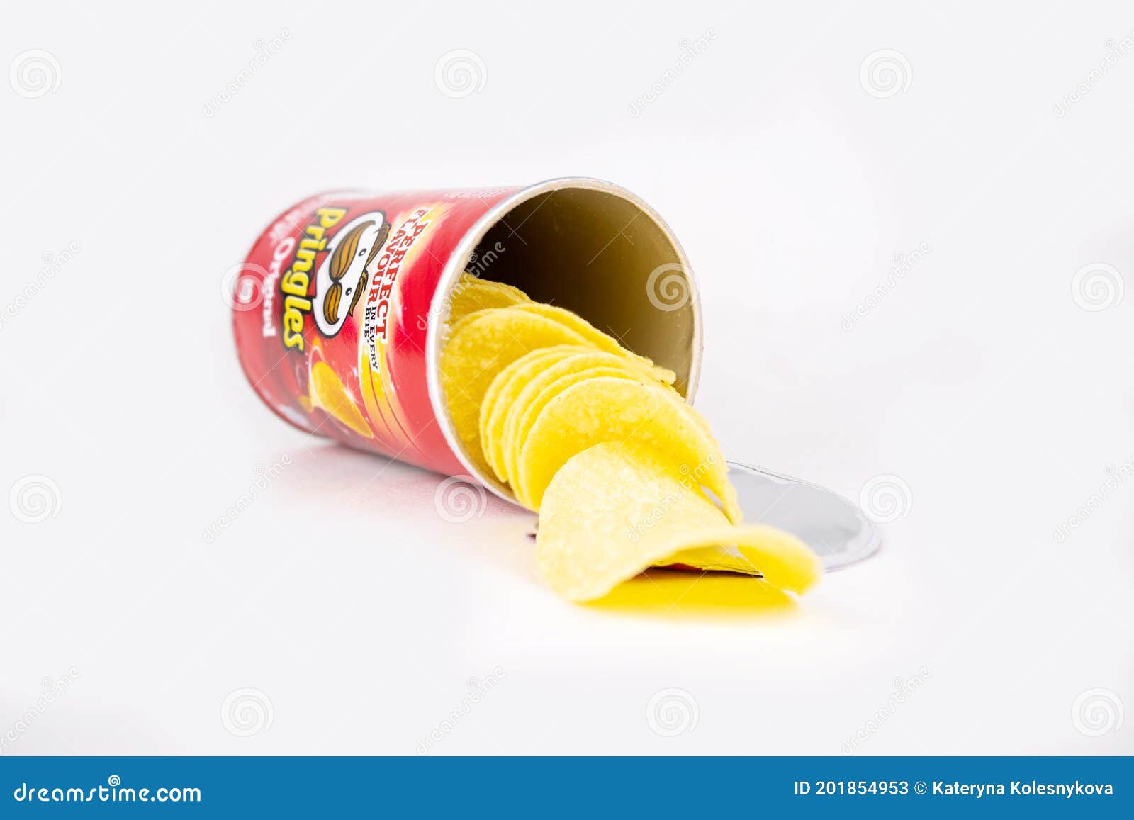 Close Up Red Pringles Snacks Cylinder Pack On Green Trees Background ...