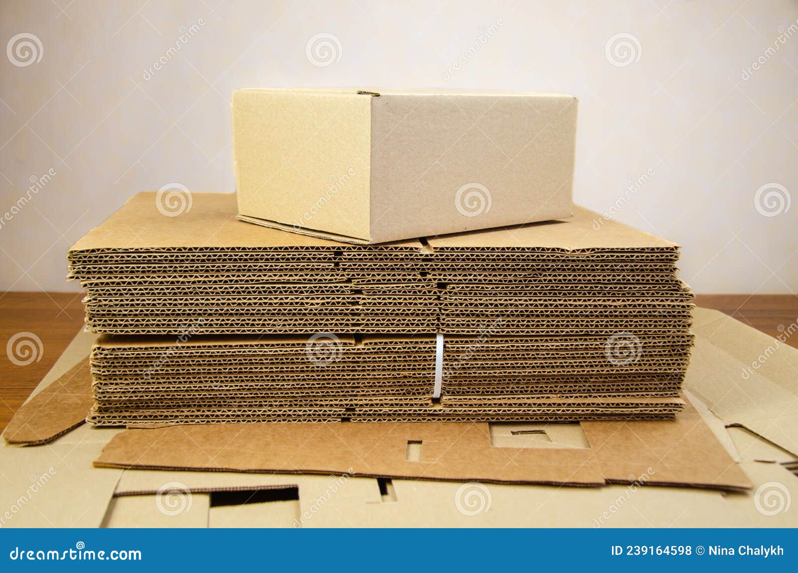 Box Ready for Product Packaging and a Stack of Folded Corrugated ...