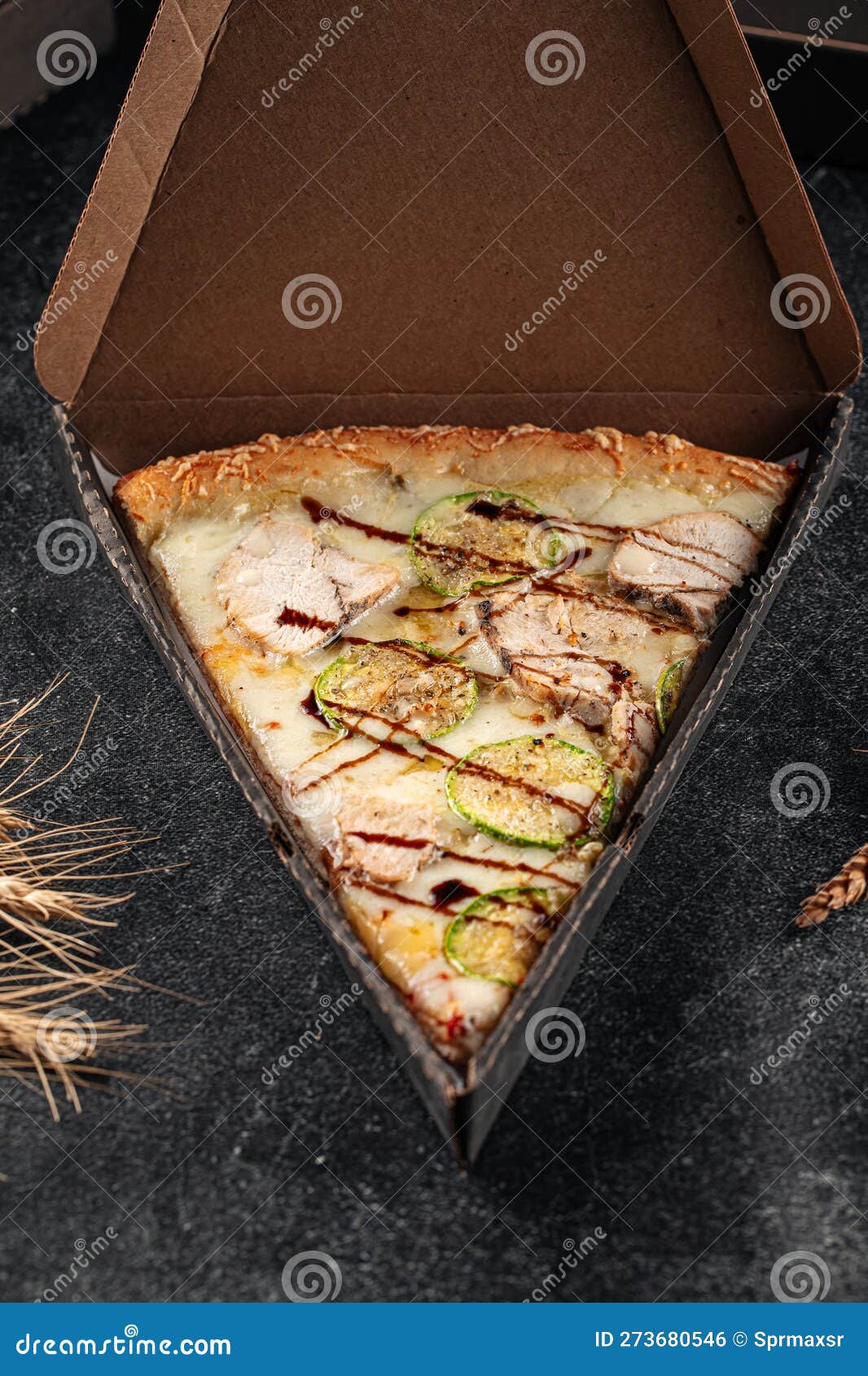 Box with Slice of Giant Chicken and Zucchini Pizza Stock Photo - Image ...