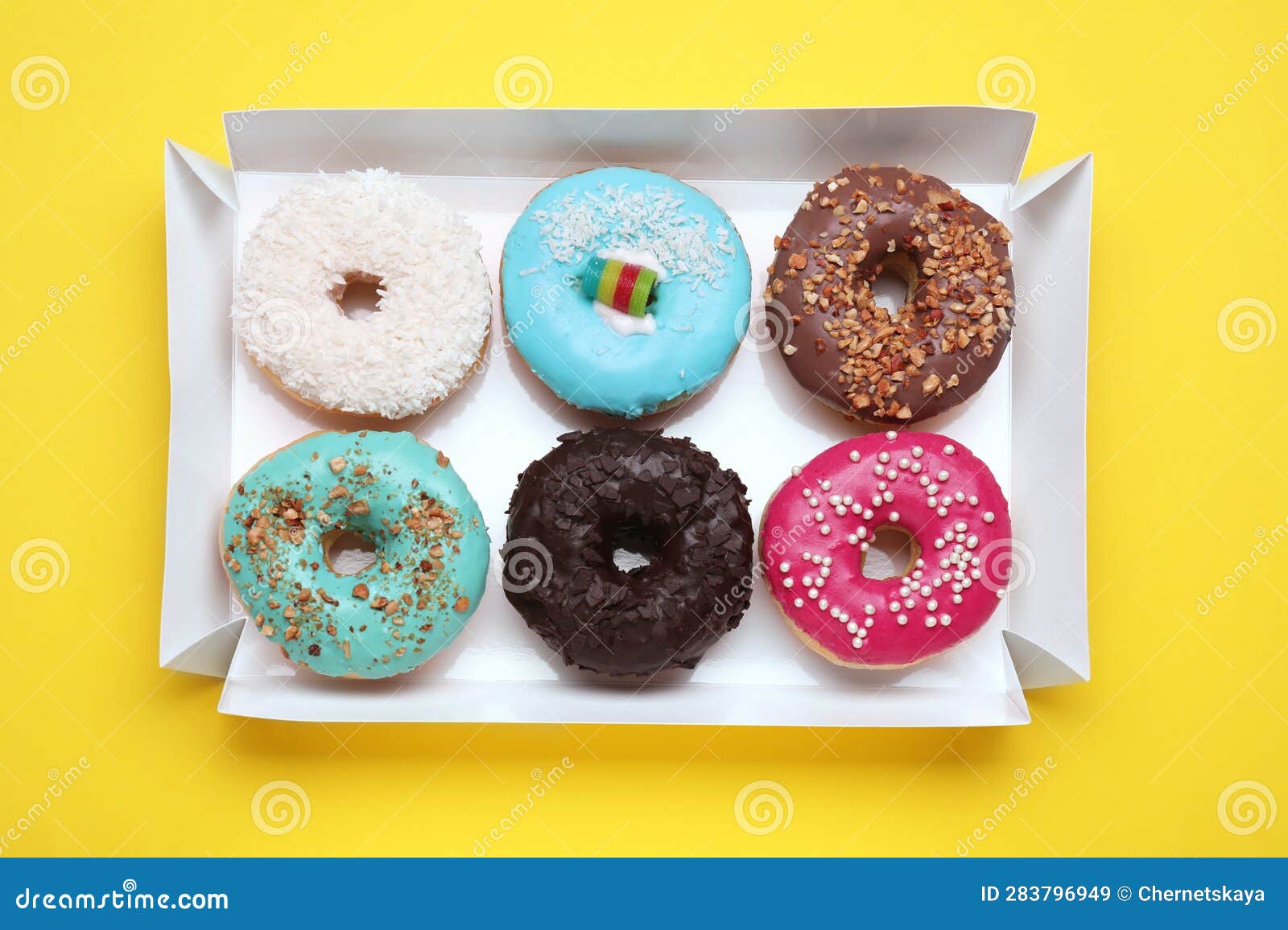 Box with Tasty Glazed Donuts on Yellow Background, Top View Stock Image ...