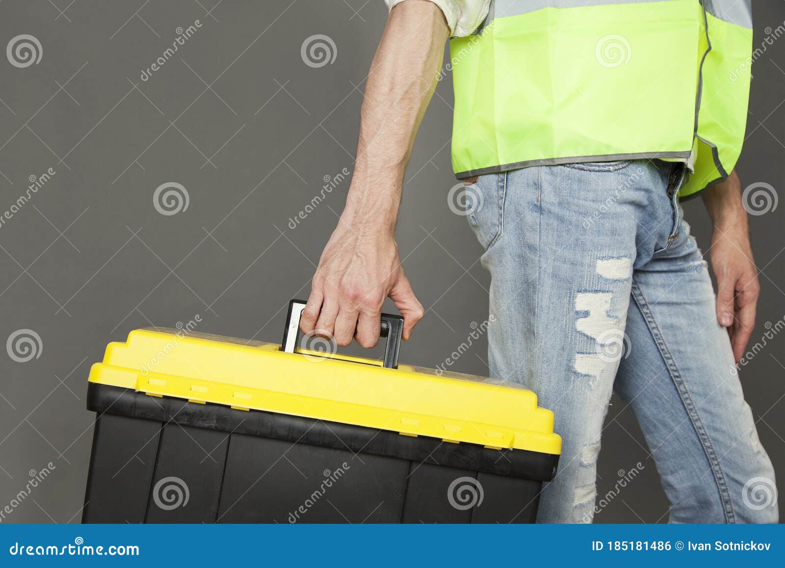 Box with Tools in the Hand of the Builder Stock Photo - Image of grey ...