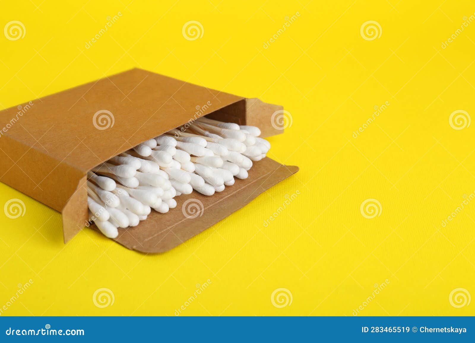 Box with Cotton Buds on Yellow Background. Space for Text Stock Image ...