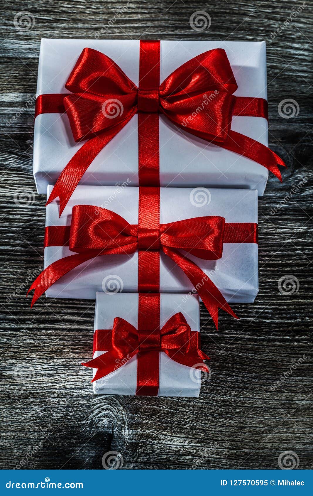 Boxed Presents with Red Knots on Wooden Board Stock Image - Image of ...