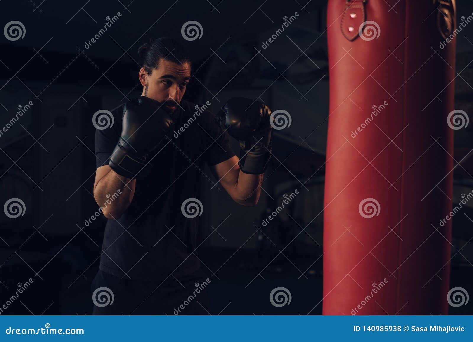 Boxer in Guard in Front of the Heavy Bag Stock Photo - Image of athlete ...