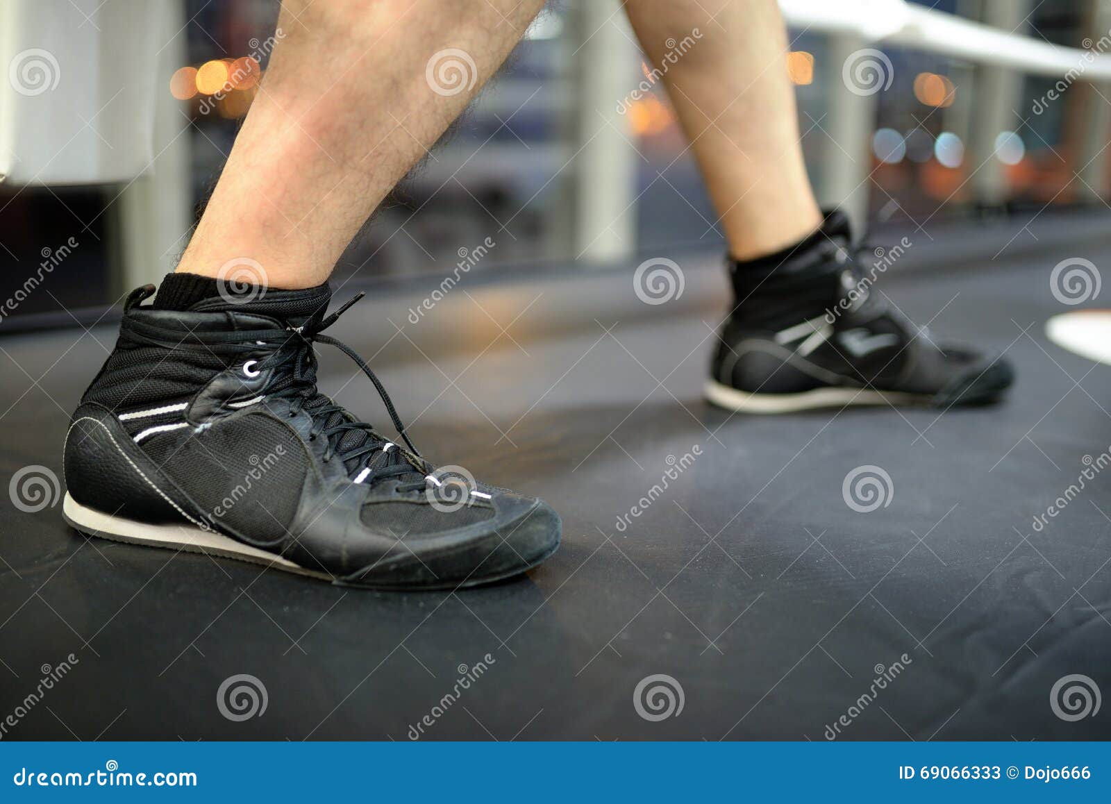 Boxer Legs Dressed in Boxing Shoes on a Ring Closeup Stock Image ...