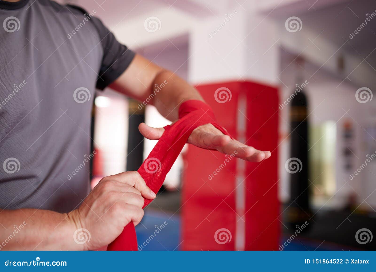 Boxer putting handwraps on stock photo. Image of exercise - 151864522