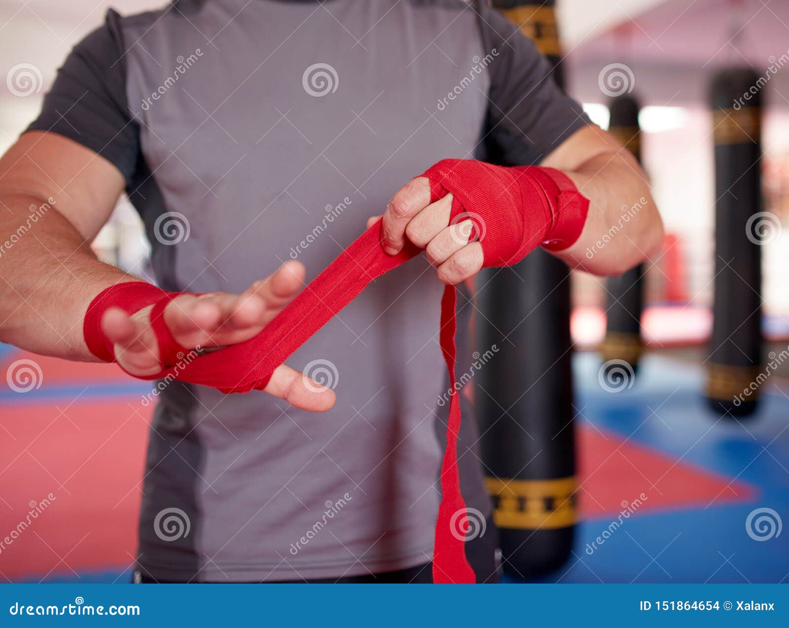 Boxer putting handwraps on stock photo. Image of sporty - 151864654