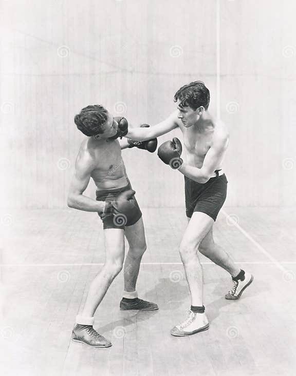 Boxer Throwing a Right Hook Stock Photo - Image of boxers, athlete ...