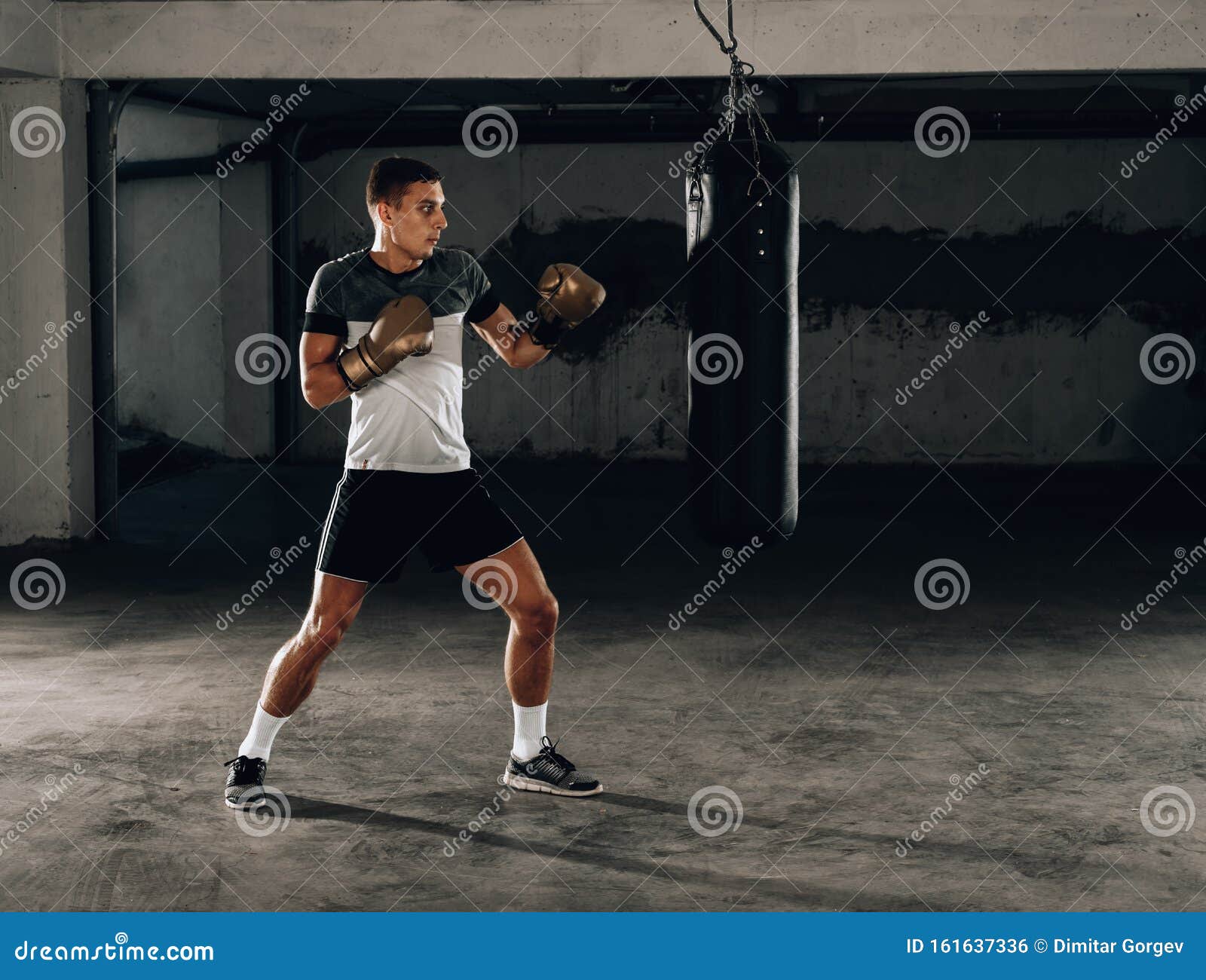 Boxer Throws Punches in the Gym while Training Stock Photo - Image of ...