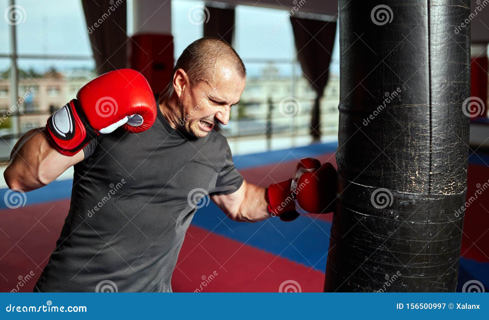 Boxer Working the Heavy Bag Stock Image - Image of body, adult: 156500997