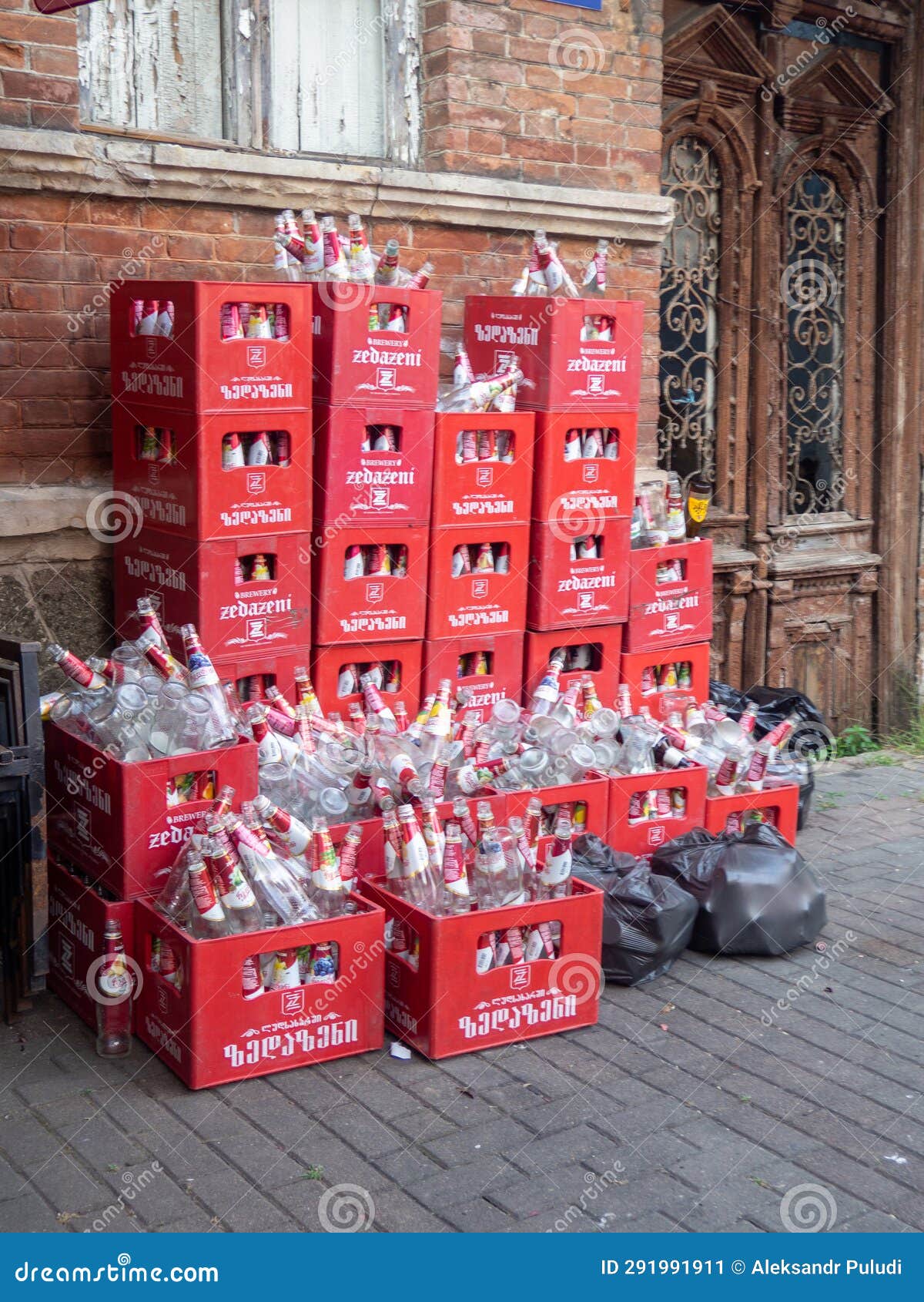 Boxes in the Backyard with Glass Containers. Lots of Empty Bottles in ...