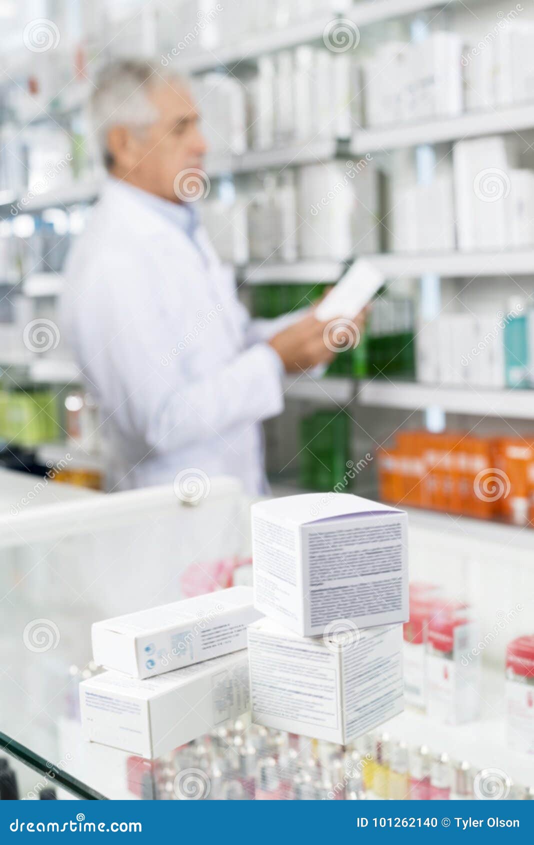 Boxes on Counter with Chemist Working in Pharmacy Stock Photo - Image ...